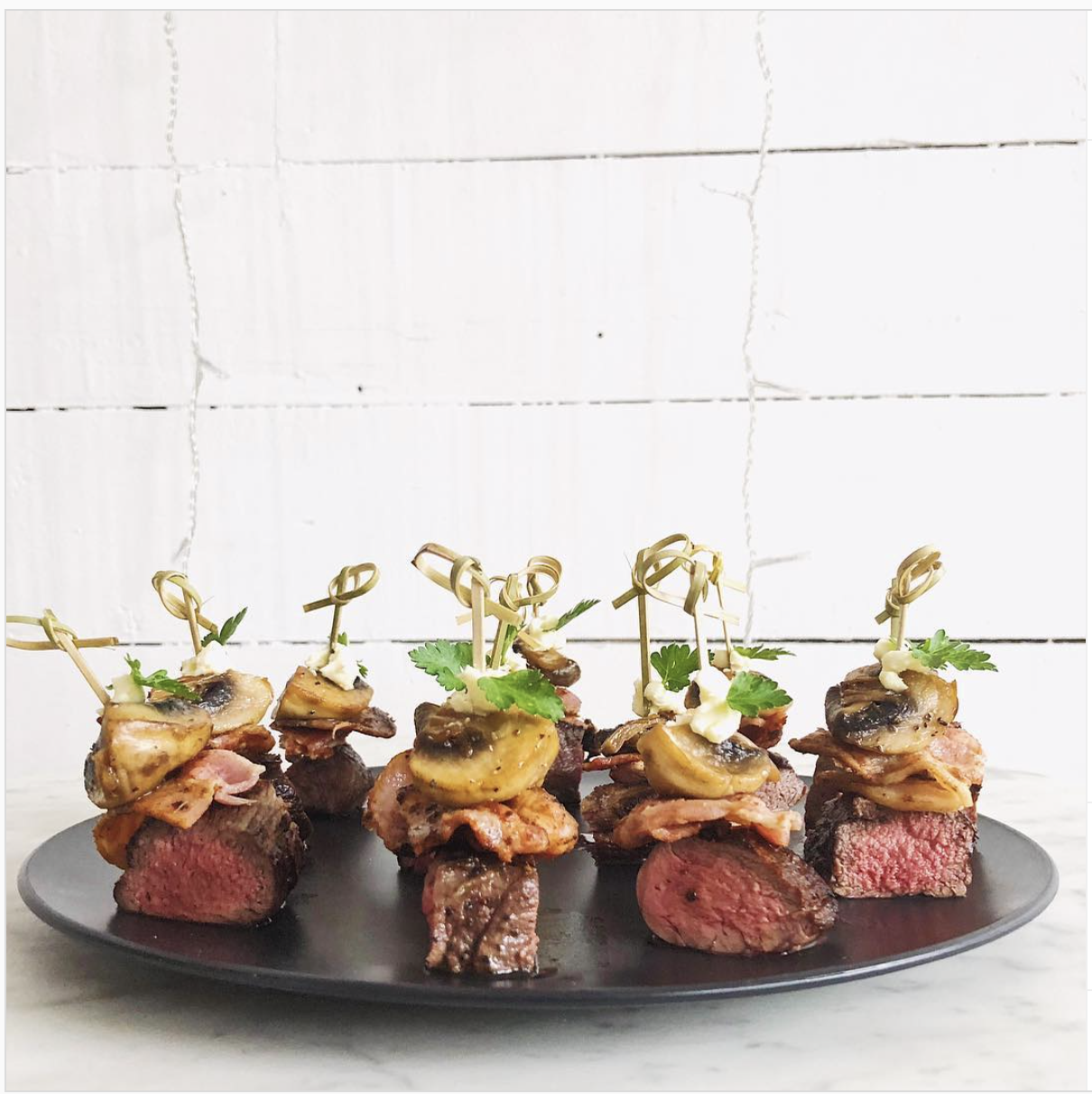 Skewers beef fillet with crispy bacon, mushroom & truffle oil