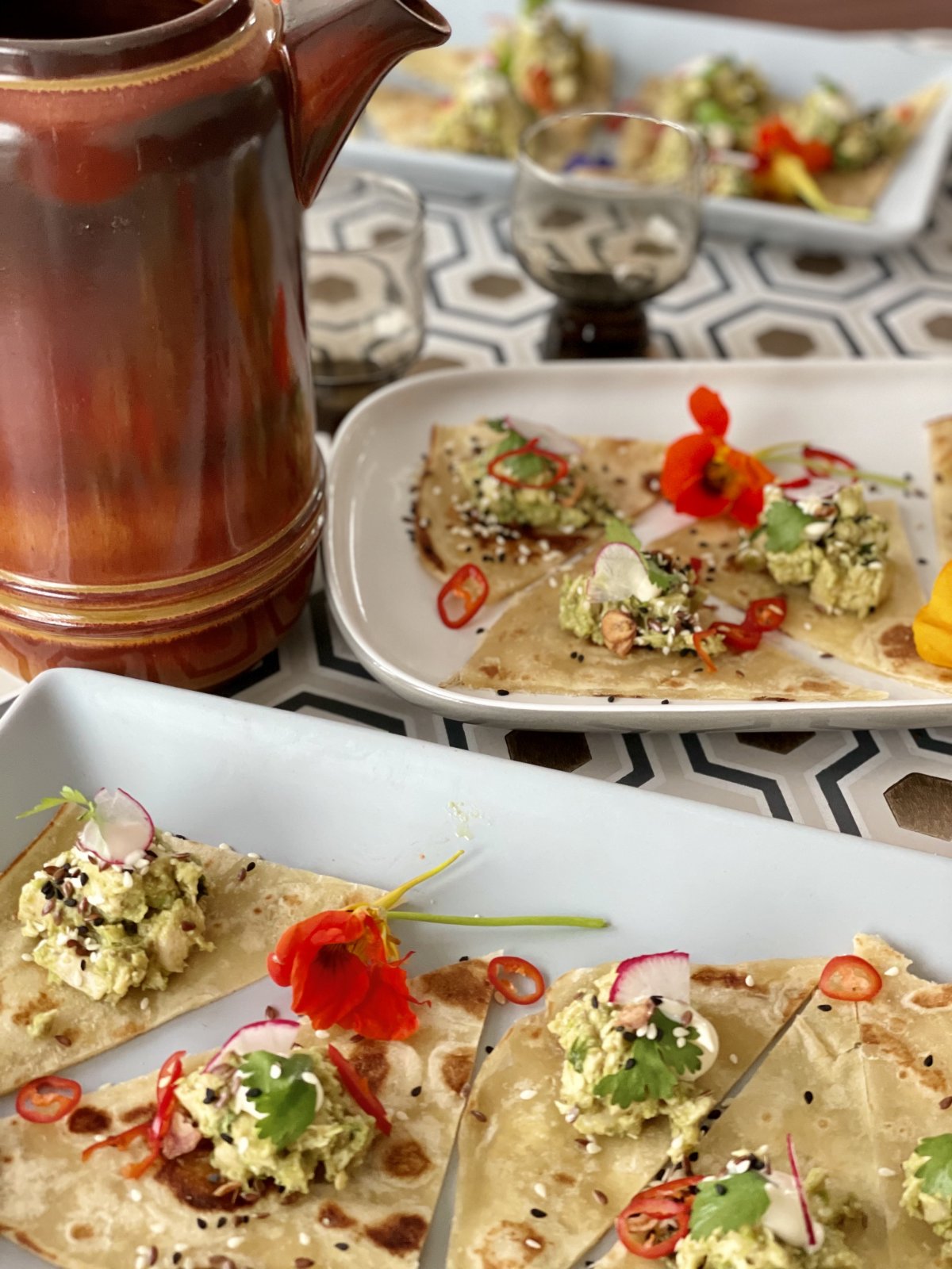 Baby roti topped with curry, coriander, mung beans and fresh chilli ...