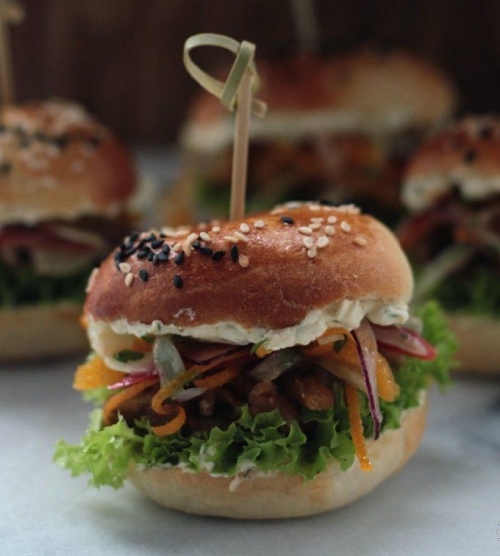 Mini bagels filled with cream cheese, smoked salmon, dill, and capers